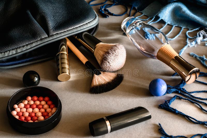 Makeup Kit. on the Table are Blush, Lipstick, Eau De Parfum, Makeup ...