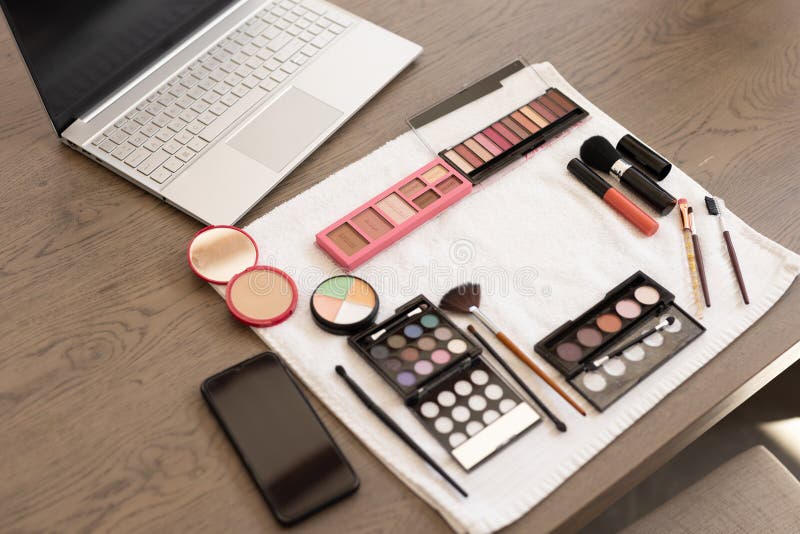 Makeup Products and Laptop on Table, Preparing for Online Beauty ...