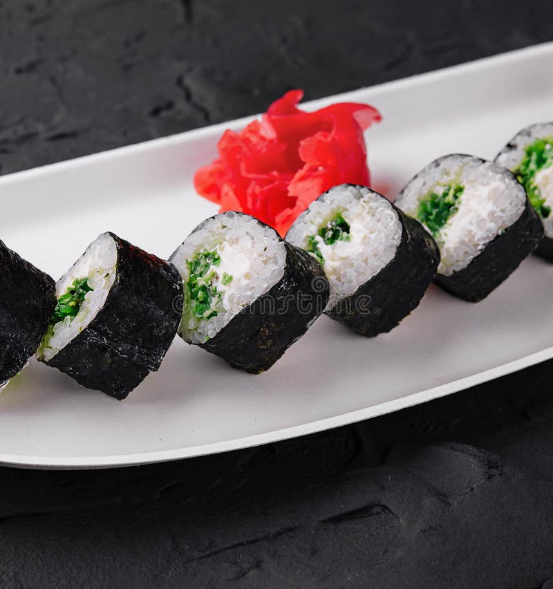 Maki Sushi with Spring Onion Inside on Plate Stock Image - Image of ...