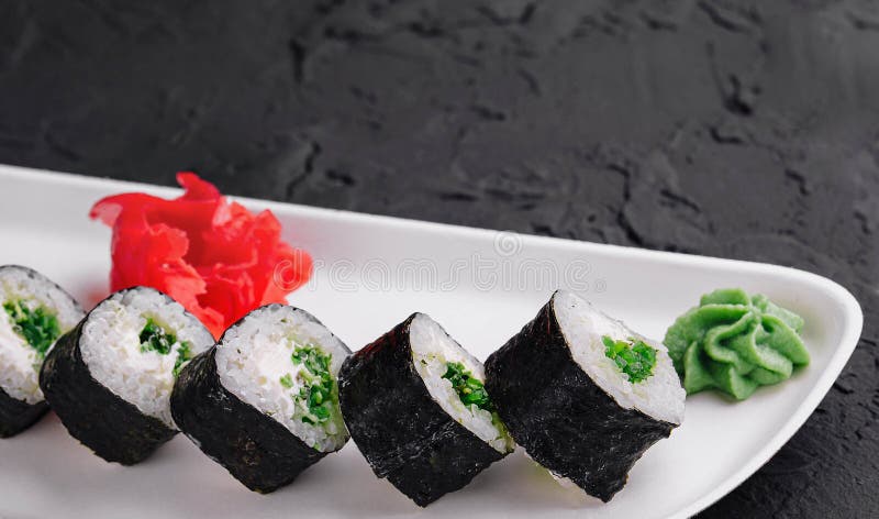 Maki Sushi with Spring Onion Inside on Plate Stock Photo - Image of ...