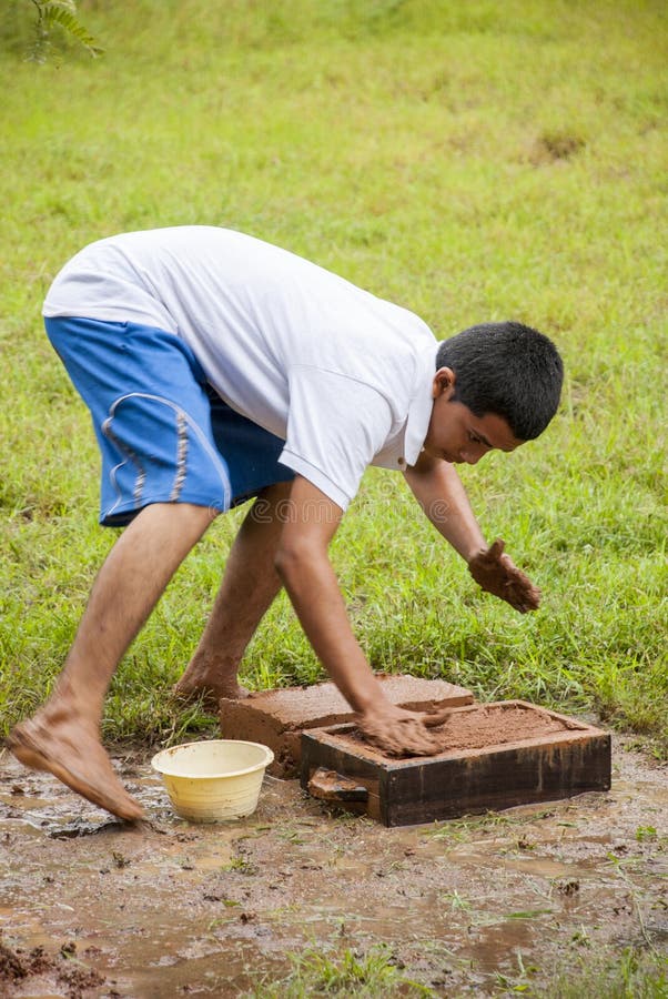 Making Adobe Bricks editorial stock image. Image of rough - 79214964