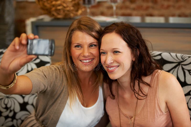 Making Another Memory. Two Friends Taking a Self-portrait of Each Other ...