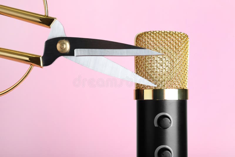 Making ASMR Sounds with Microphone and Scissors on Pink Background ...