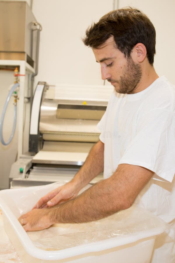 Chief Baker Preparing Dough for Bread in a Bakery. Kitchen Professional ...