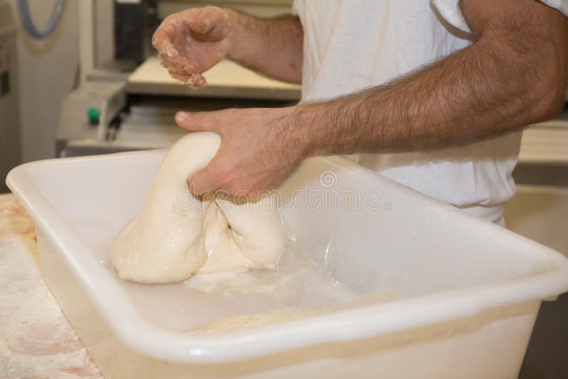 Chief Baker Preparing Dough for Bread in a Bakery. Kitchen Professional ...