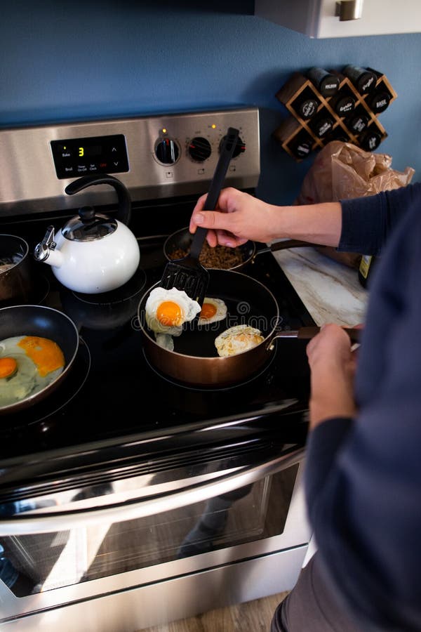 Making breakfast eggs stock image. Image of rainbow - 239856803