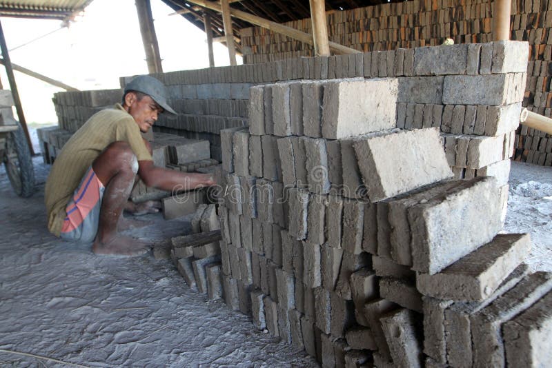 Making bricks from clay editorial stock image. Image of making - 31523374