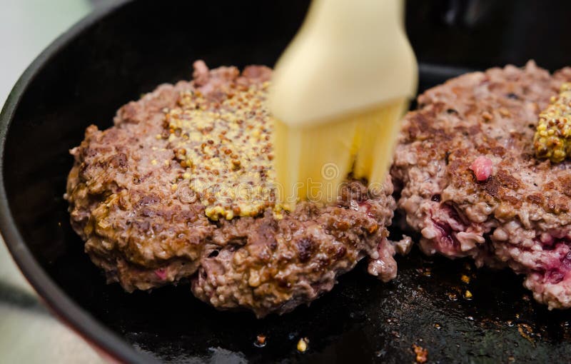 Making Burgers with Mustard Stock Photo - Image of delicious, american ...