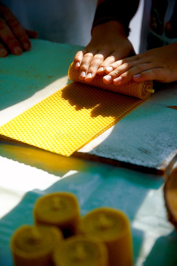 Making Candle from Honey Bee Wax Plate at Market. Stock Image - Image ...