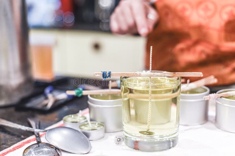 Making Candles at Home and Adding a Wick To Liquid Candle Wax Stock ...