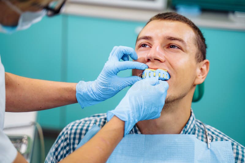 Making Cast of the Upper Row of Teeth Using a Special Plate and Soft ...