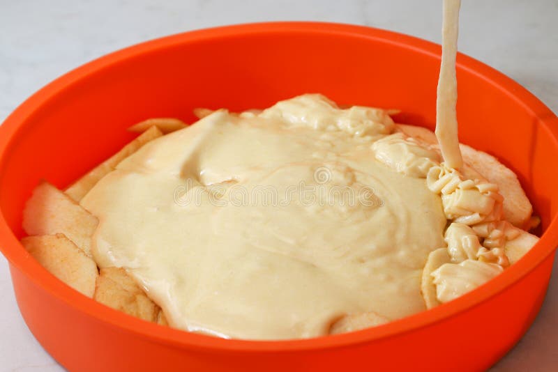Making Charlotte Apple Pie. Pouring the Batter into the Cake Pan on Top ...