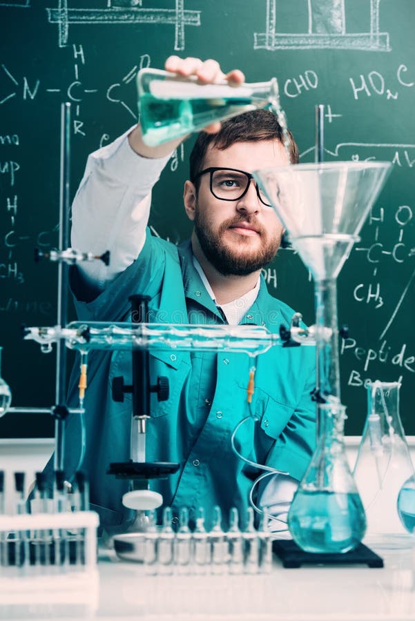 Making chemical experiment stock photo. Image of male - 119464592