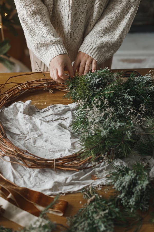 Making Christmas Rustic Wreath. Hands Holding Evergreen Branches ...