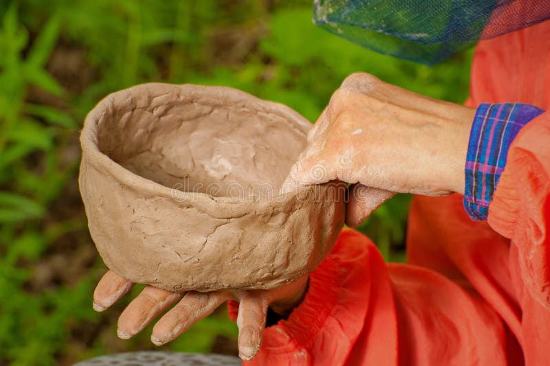 Making Clay Dishes Manually. Big Hands. on the Street Stock Image ...