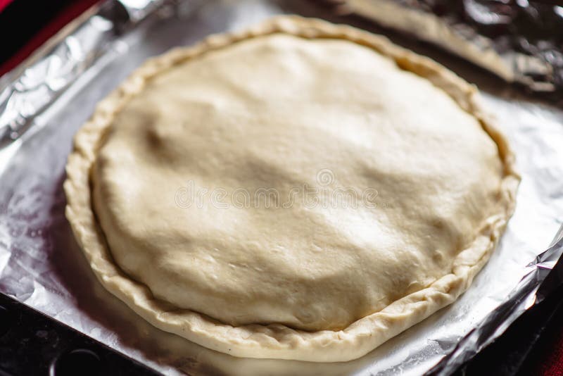 Making a Closed Pie. Round Raw Pie on a Baking Sheet Stock Image ...