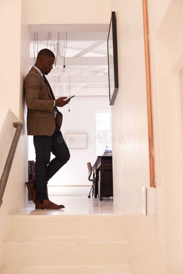Making Contact with a Client. a Young Businessman Using a Cellphone in ...