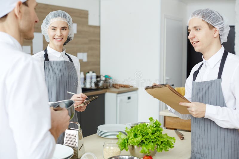 Trainees making notes stock image. Image of apron, occupation - 118629417