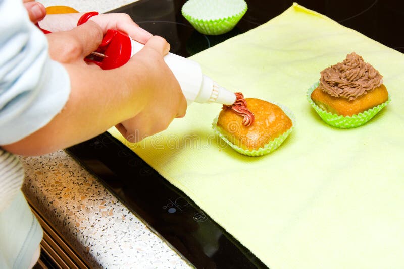 Making cupcakes stock image. Image of lifeguard, celebration - 49056285