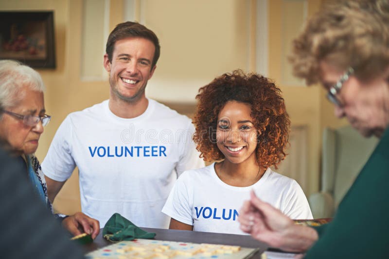 Making a Difference. Portrait of Volunteers Working with Seniors at a ...