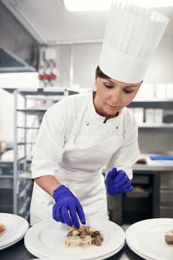 Making a Dinner into Art. a Chef Plating Food for a Meal Service in a ...