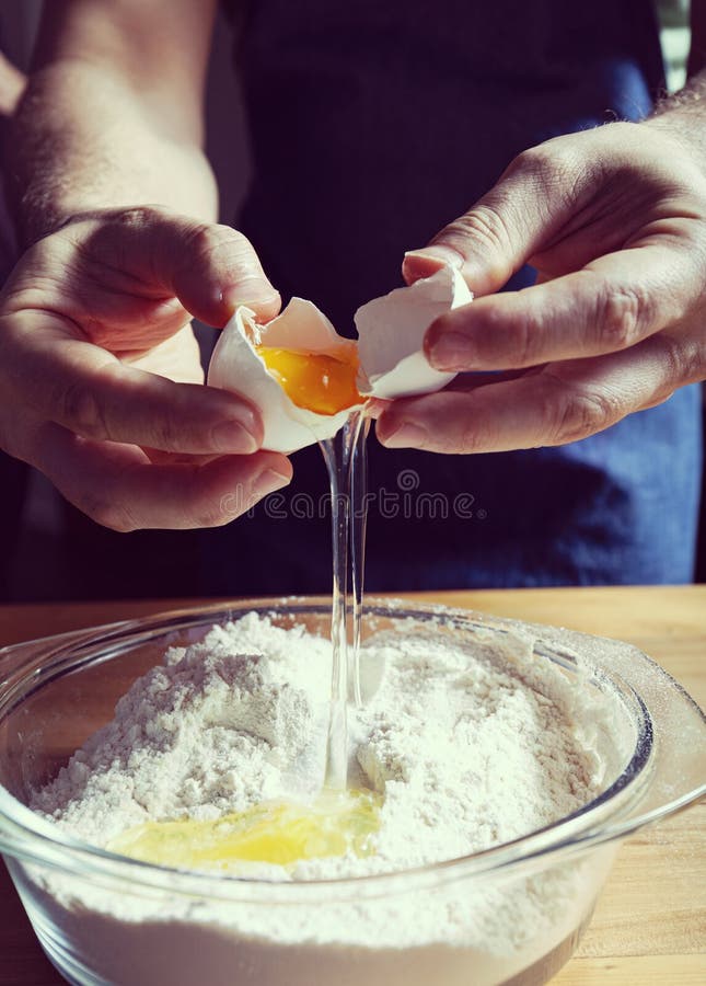 Making the Dough Adding Eggs To the Flour.Cooking Process Stock Photo ...