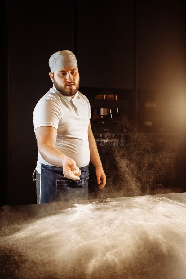 Chef Scattering Flour on the Table for Kneading Dough Stock Photo ...