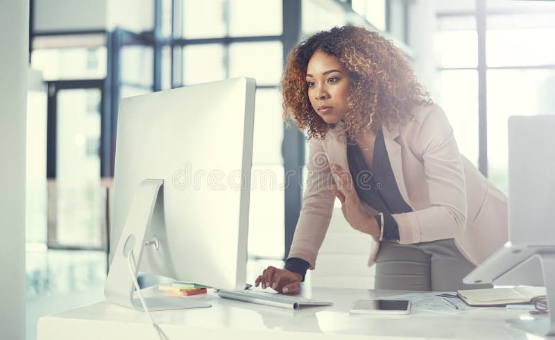 Making Every Second of the Workday Count. a Young Businesswoman Using a ...