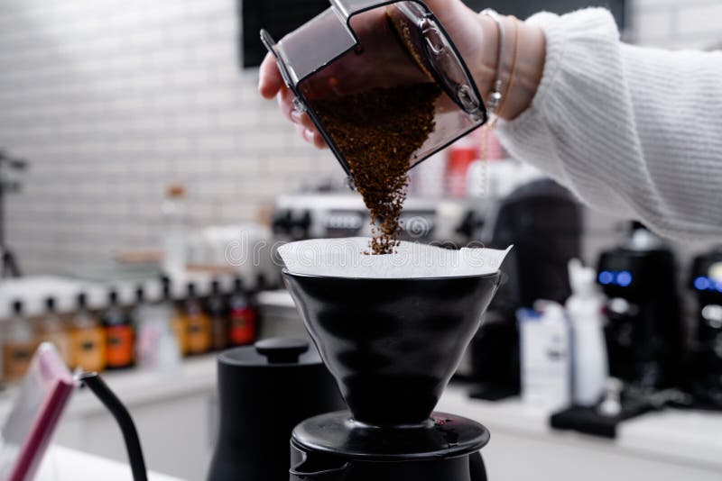 Making Filter Coffee. Add Coffee. Hand with Coffee Over Natural ...