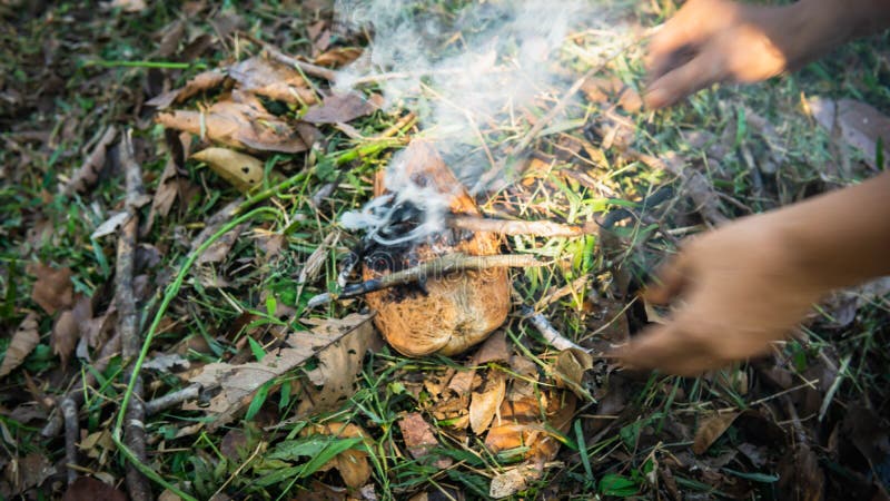 Making a Fire Using a Hot Coal from Dried Tree Branches and Coconut ...