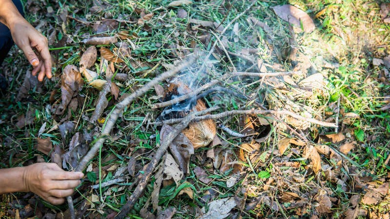 Making a Fire Using a Hot Coal from Dried Tree Branches and Coconut ...