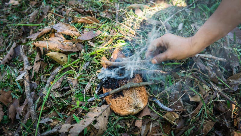 Making a Fire Using a Hot Coal from Dried Tree Branches and Coconut ...