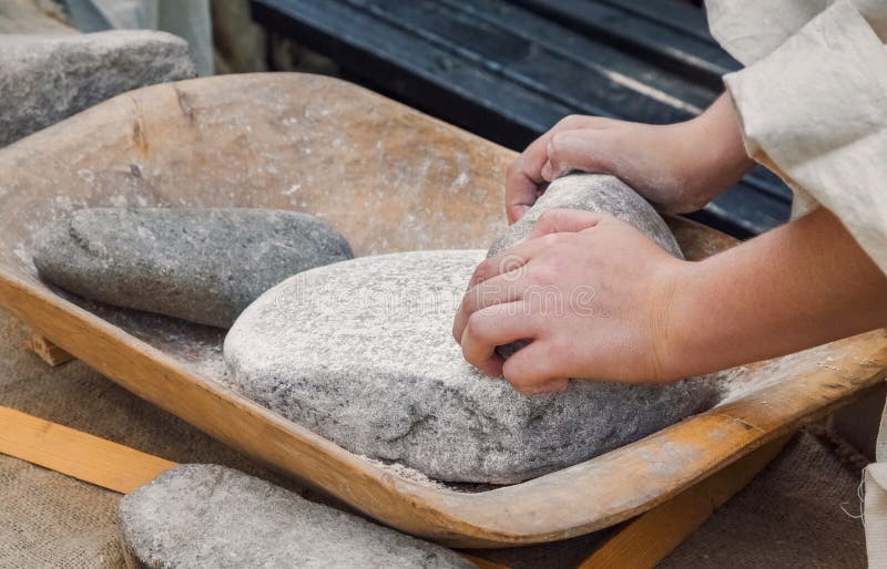 Making Flour in a Traditional Way for the Neolithic Era Stock Image ...