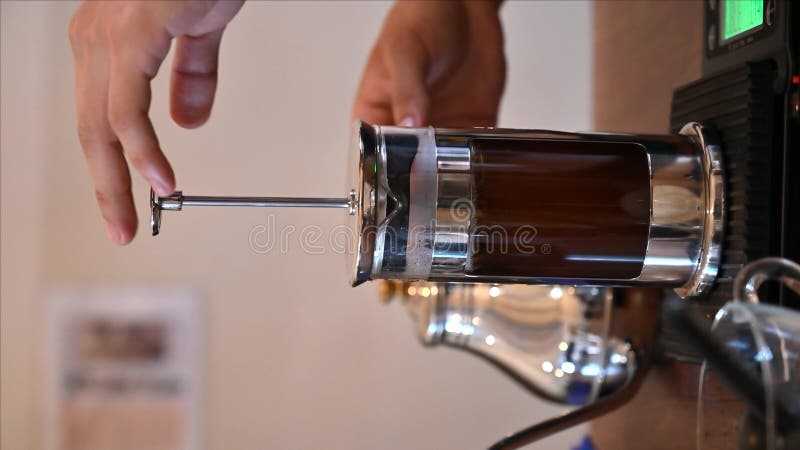 Making French Press Coffee. Pressing the Plunger Down Stock Photo ...