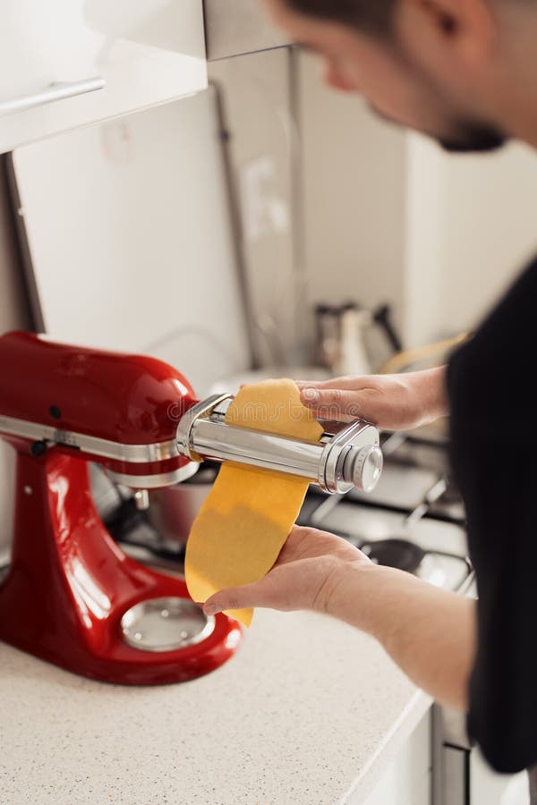 Making Fresh Pasta Dough with Red Kitchen Appliance Stock Photo - Image ...