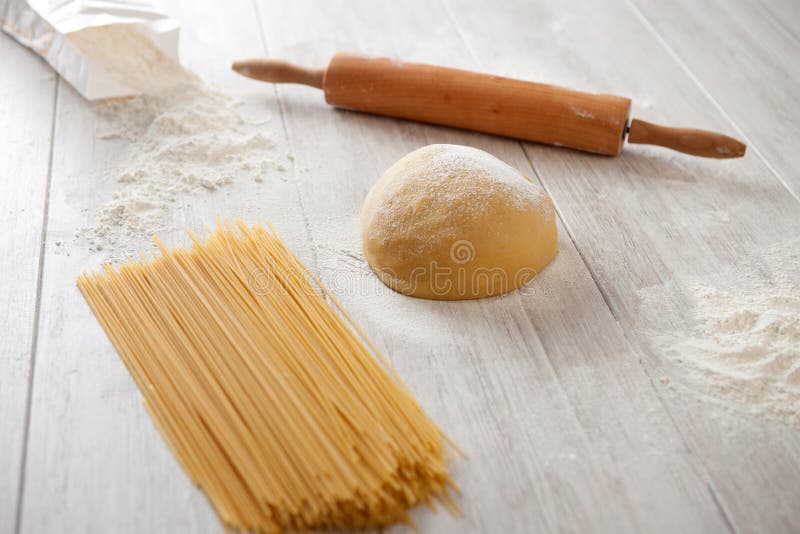 Making fresh spaghetti stock photo. Image of kneading - 63908738