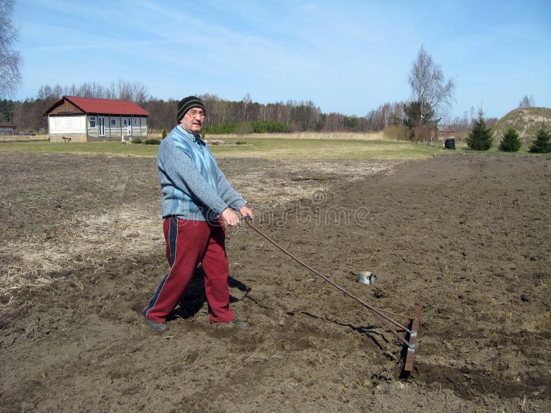 Making furrows stock image. Image of tool, senior, homemade - 30658409