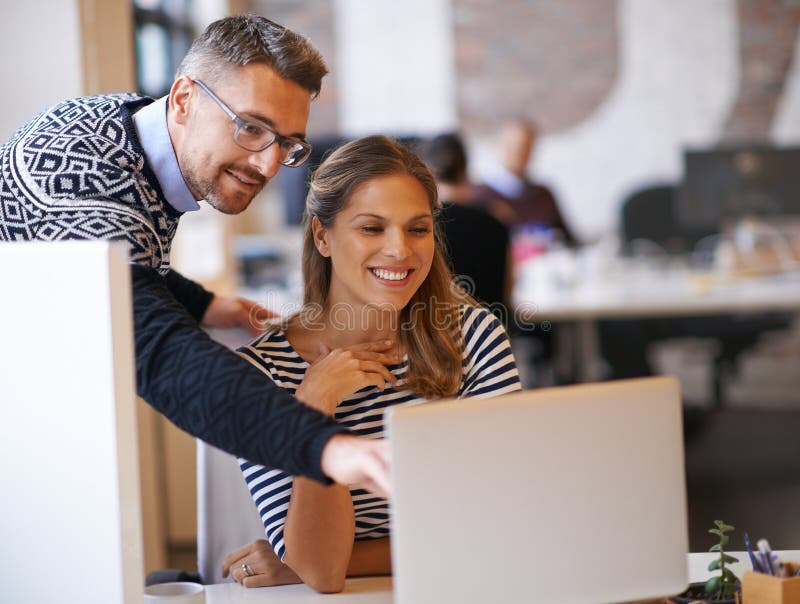 Making Great Progress on Their Project. Two Designers Working Together ...