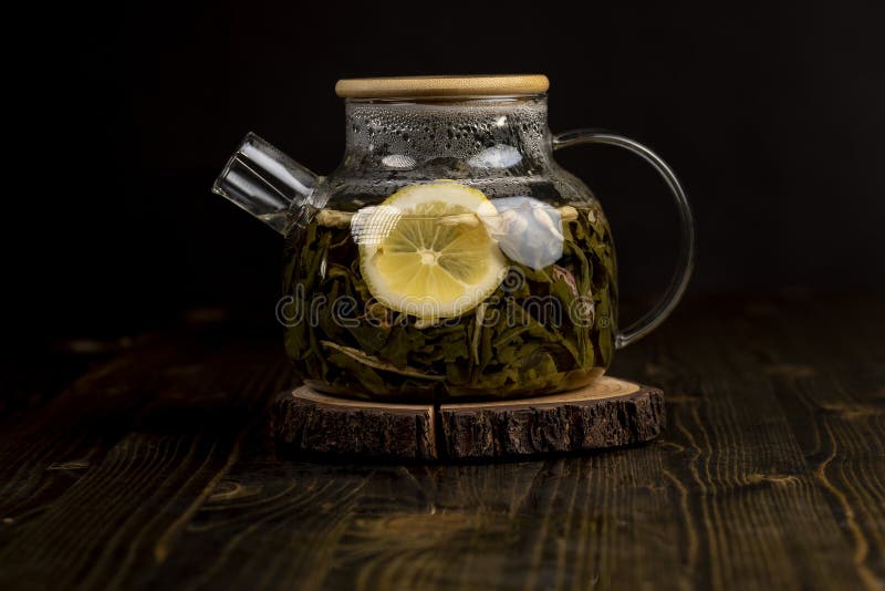 Making Green Tea in a Glass Teapot with Lemon and Mint Stock Photo ...