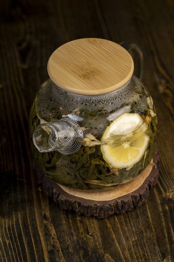 Making Green Tea in a Glass Teapot with Lemon and Mint Stock Image ...