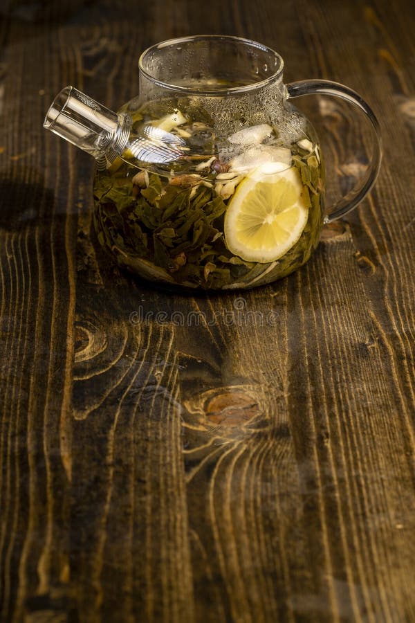 Making Green Tea in a Glass Teapot with Lemon and Mint Stock Image ...