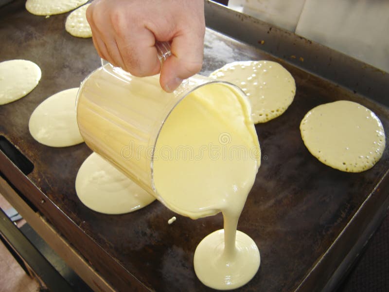 Making Griddle Cakes stock photo. Image of griddle, cooking - 574652