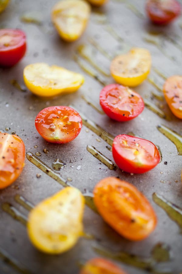 Making half dried tomatoes stock image. Image of diet - 104847173