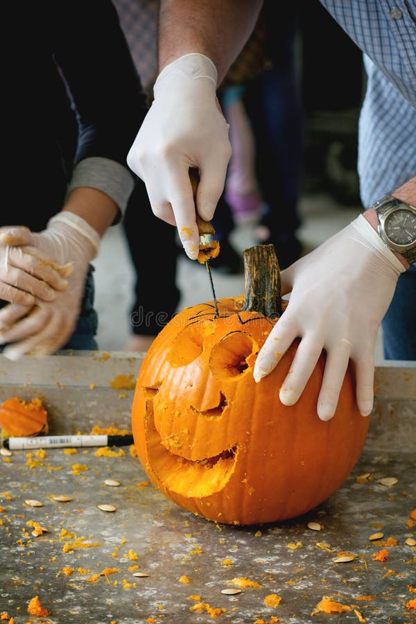 Making Halloween pumpkins stock photo. Image of halloween - 60376866