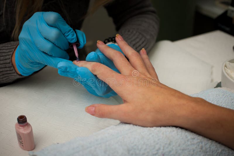 Making Hand Nails in a Professional Hand Care Salon - Manicure Stock ...