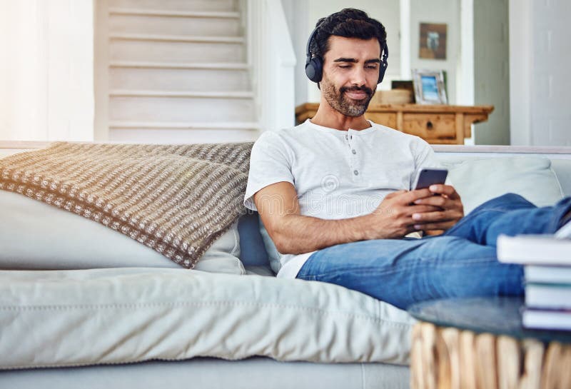 Making His Weekend As Relaxing As Possible. a Man Relaxing on the Sofa ...