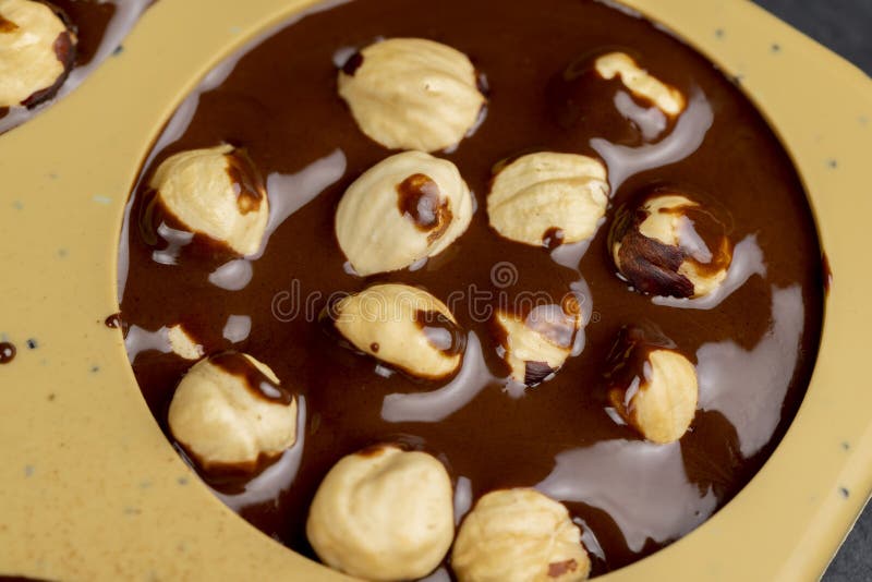 Making Homemade Chocolate with Cocoa Butter and Nuts Stock Photo ...