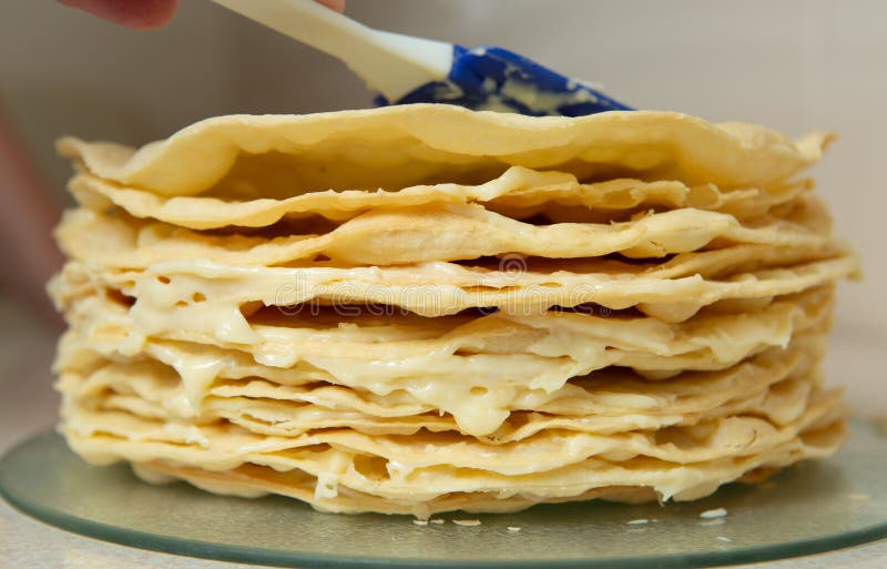 Making Homemade Napoleon Cake. Many Layers of Cake Smeared with Cream ...