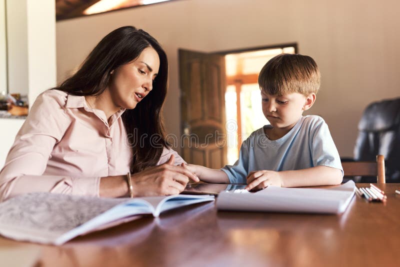 Making Homework a Bonding Activity. a Mother Helping Her Son with His Homework. Stock Image ...
