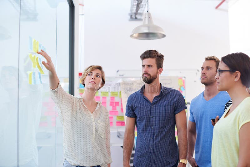 Making Ideas Happen. a Group of Colleagues Discussing Ideas Together on ...